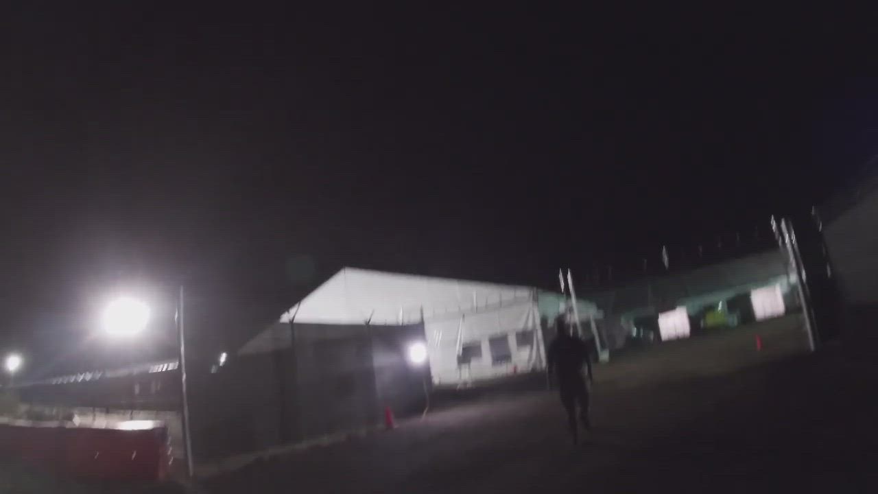 Attorney Brian Blem interviews a security guard at a camp for immigrant ...